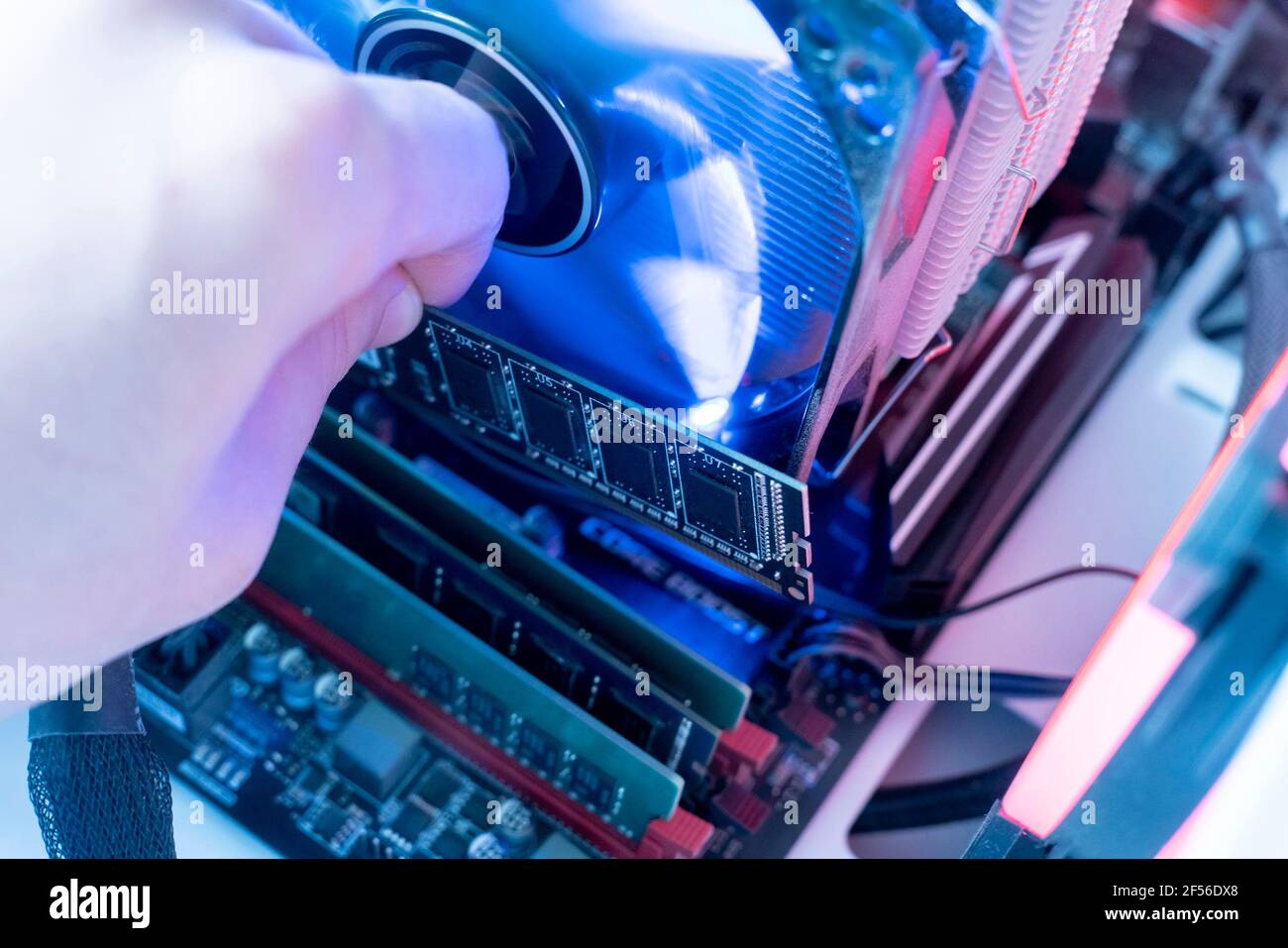 the inserting plug in the ram ddr memory card in the computer mainboard ... the inserting plug in the ram ddr memory card in the computer mainboard ...