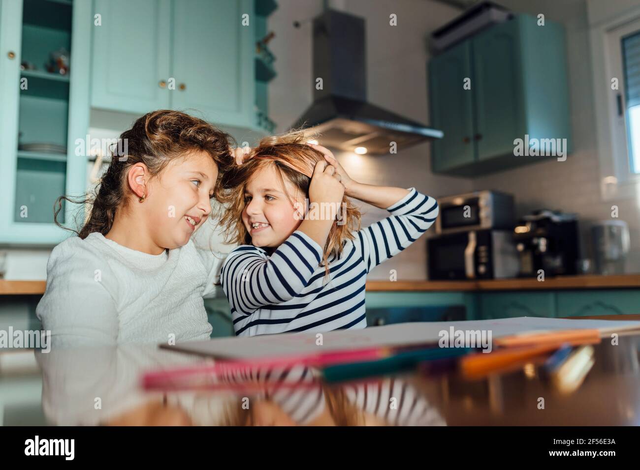 Girl playing with her hair hi-res stock photography and images - Alamy