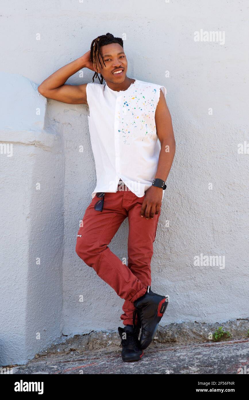 Full body portrait of smiling african man with dreadlocks Stock Photo ...