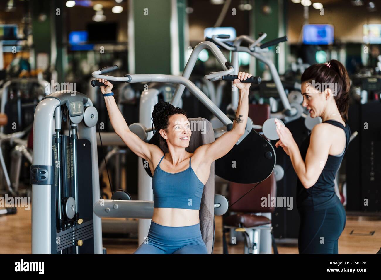 Three women in gym talking hi-res stock photography and images - Alamy