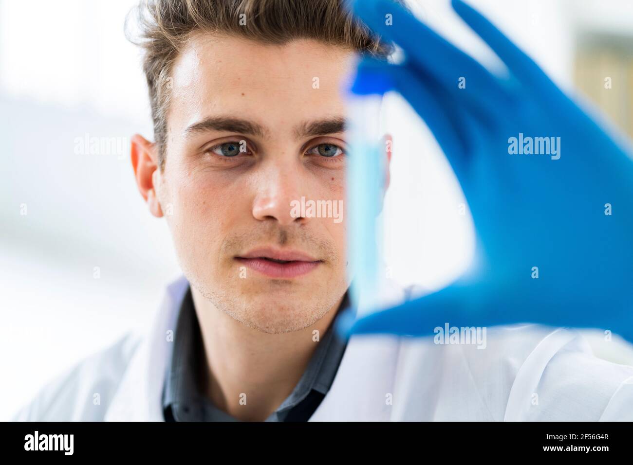 Scientist holding tube test hi-res stock photography and images - Alamy