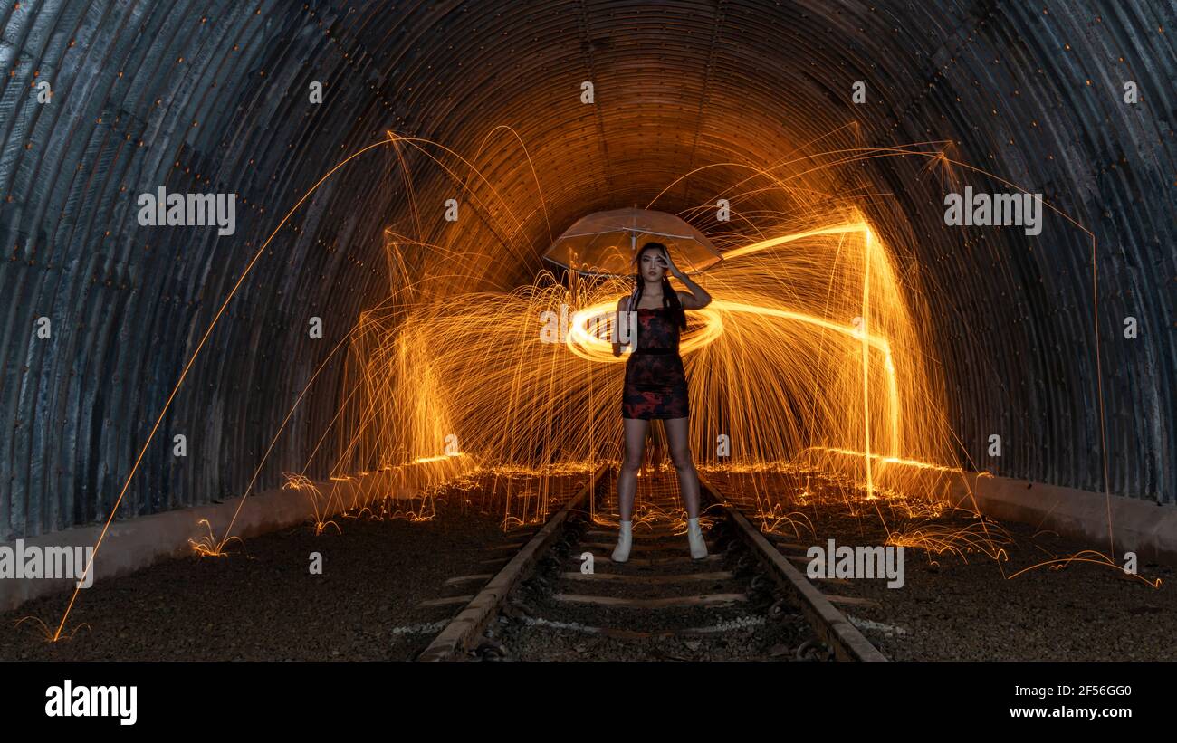 Woman spinning wire wool in tunnel Stock Photo - Alamy