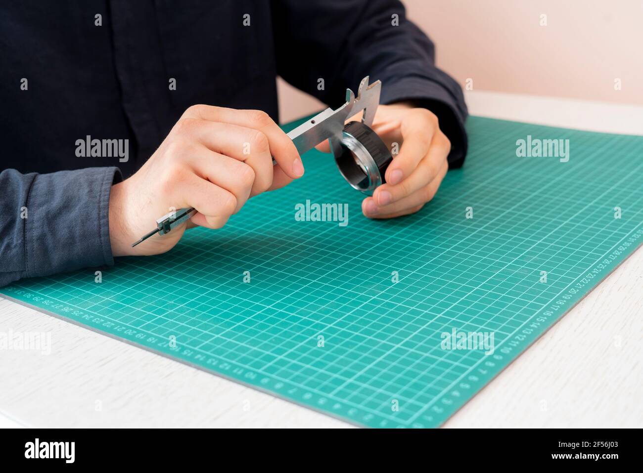 the engineer hand working and measure the parts with caliper tool Stock ...