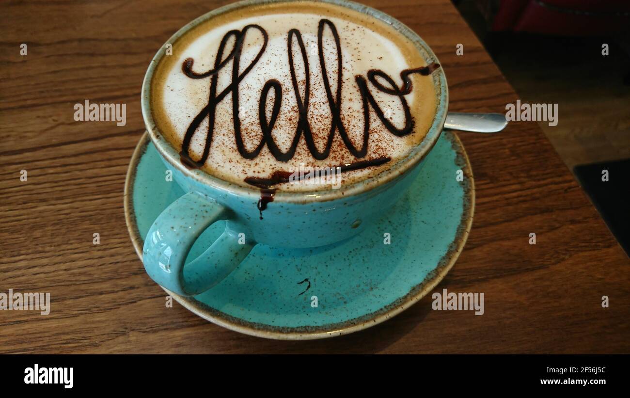 Coffee cup with Hello on the top of the coffee Stock Photo - Alamy