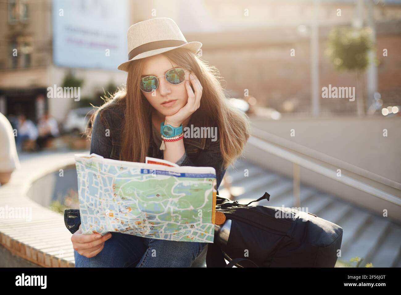 Confused woman holding map hi-res stock photography and images - Alamy