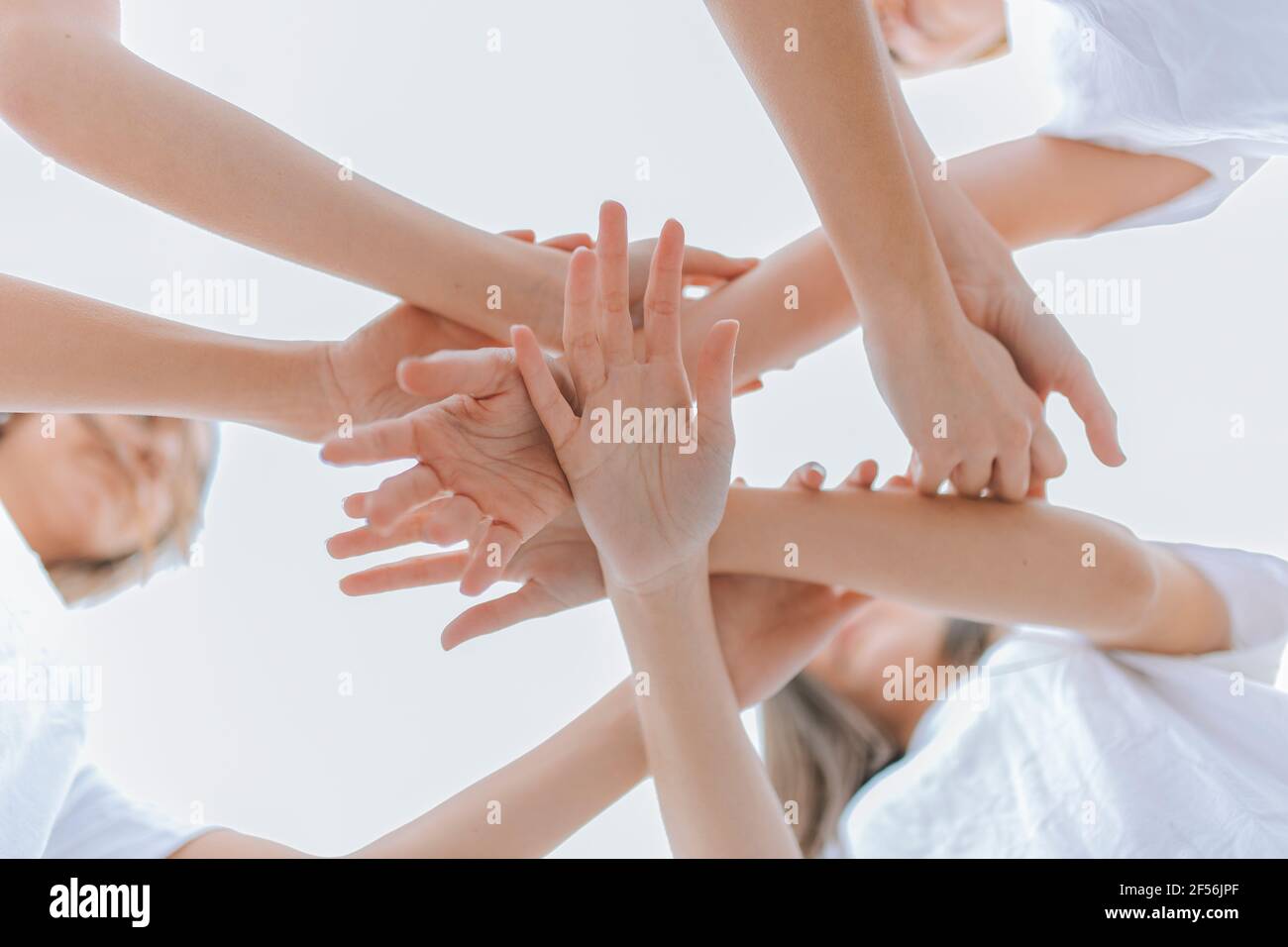 Stacked hands hi-res stock photography and images - Alamy