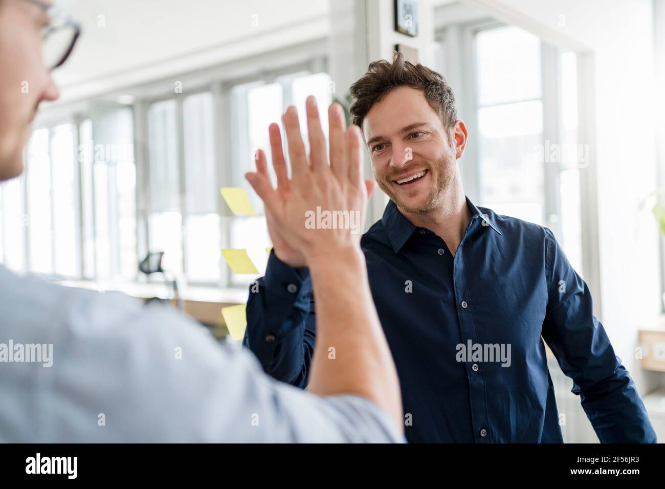 Office team high five hi-res stock photography and images - Alamy