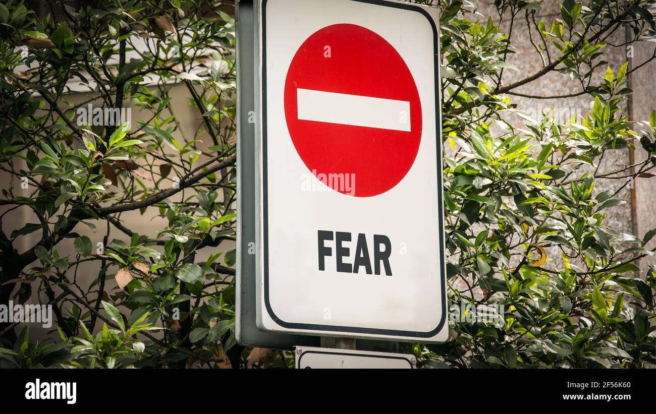 Street Sign the Direction Way to Courage versus Fear Stock Photo - Alamy