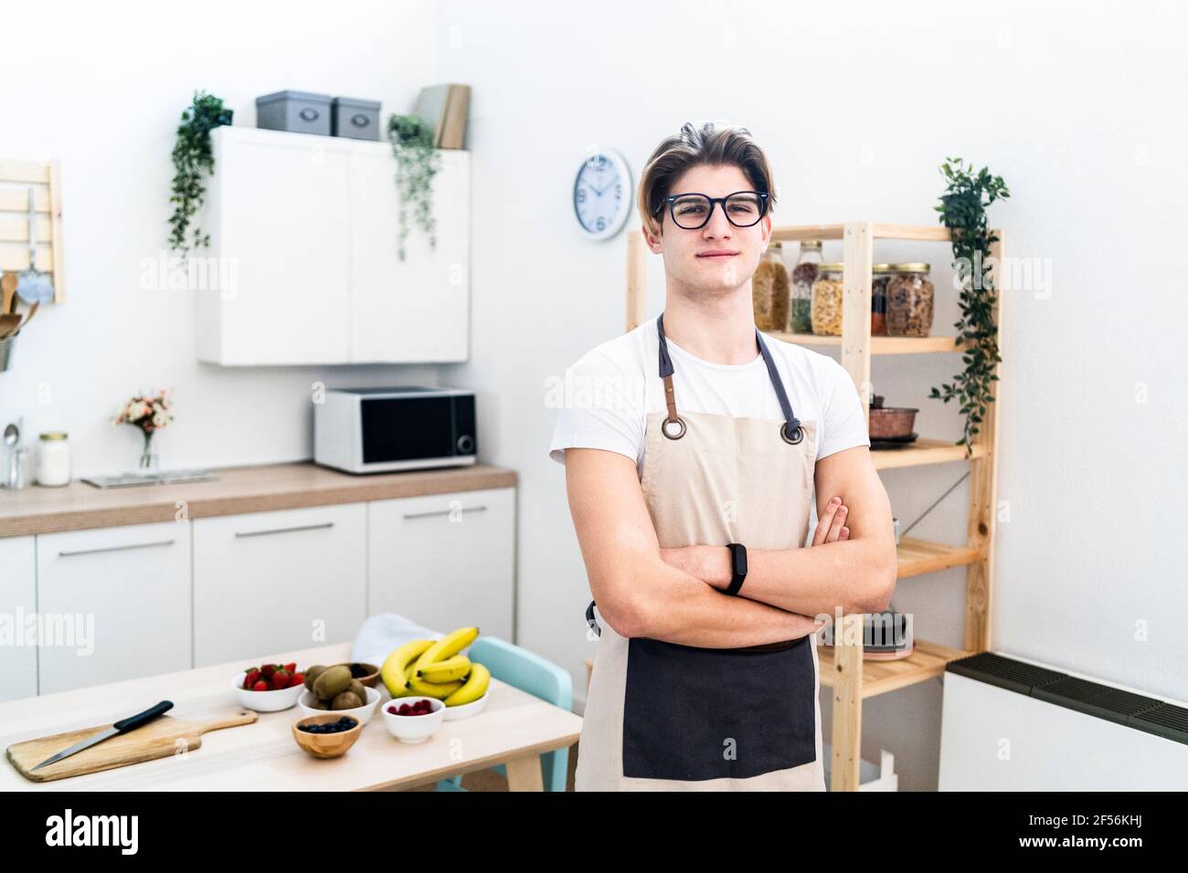 Young attractive man in apron hi-res stock photography and images - Alamy