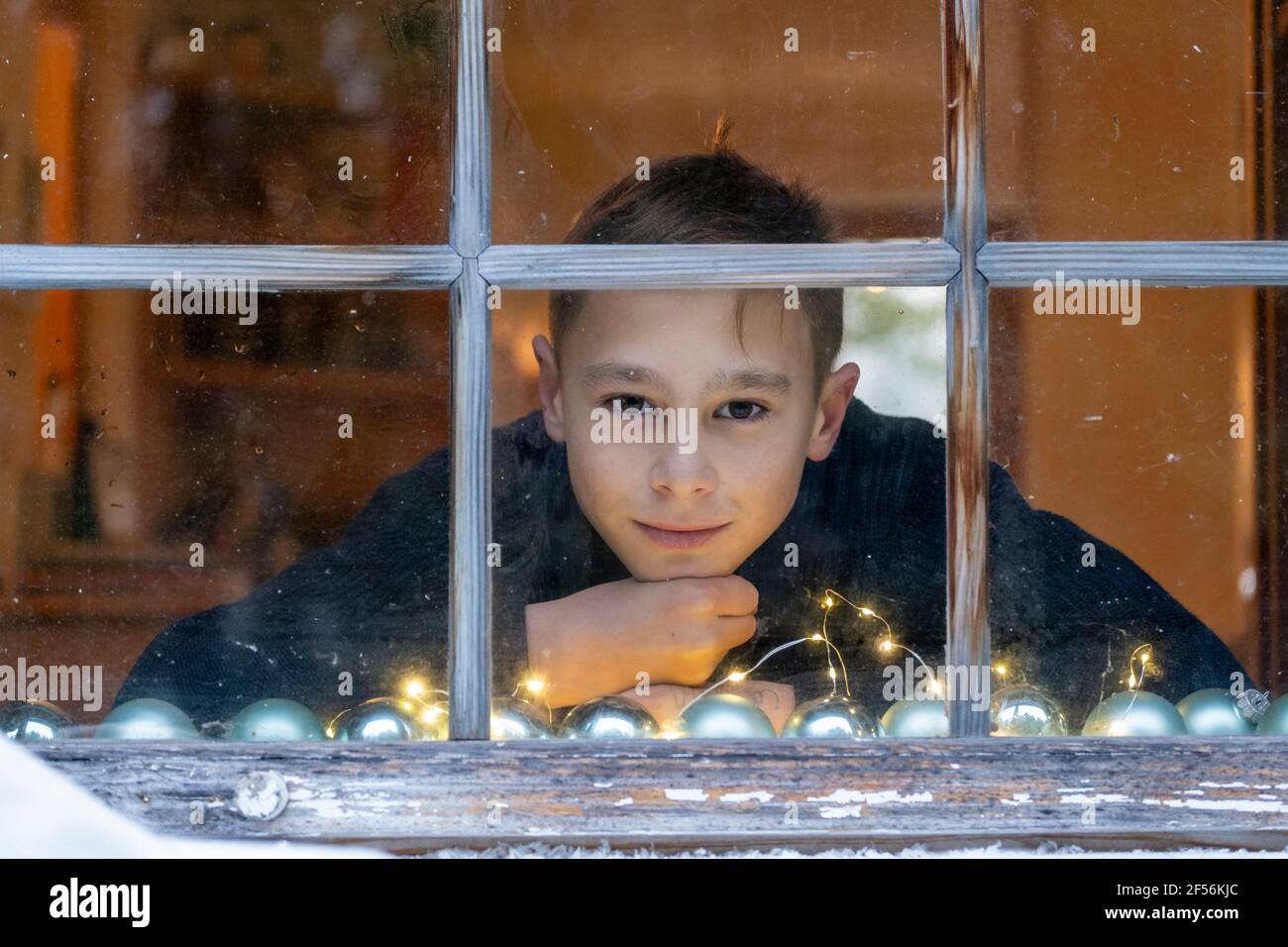 Boy lighting christmas tree hi-res stock photography and images - Alamy