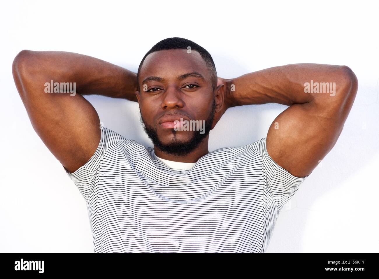 Close up portrait of serious muscular man standing isolated on white ...