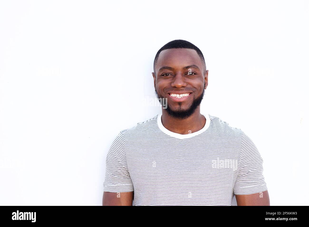 Close up portrait of friendly handsome man standing isolated on white ...