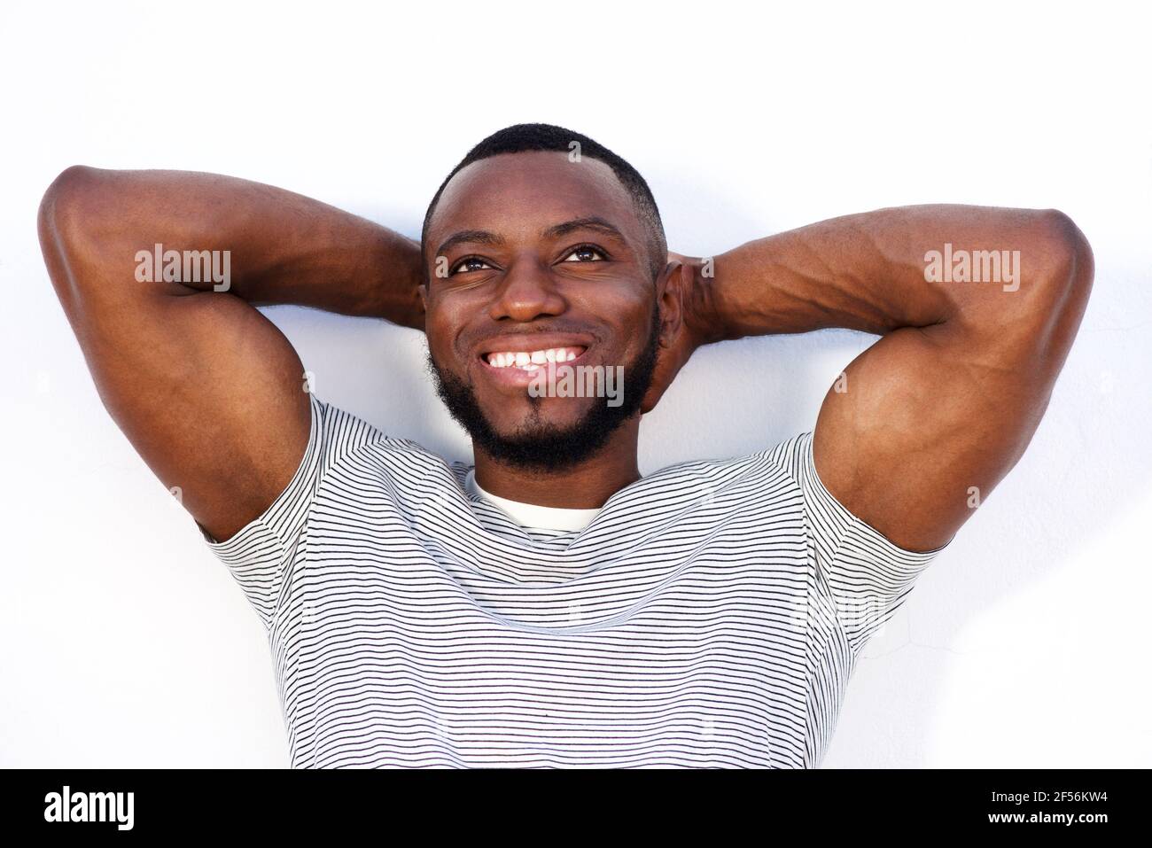 Close up portrait of laughing muscular man standing isolated on white ...