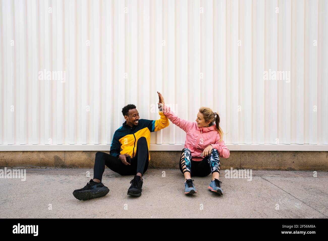 Man woman doing high five hi-res stock photography and images - Alamy