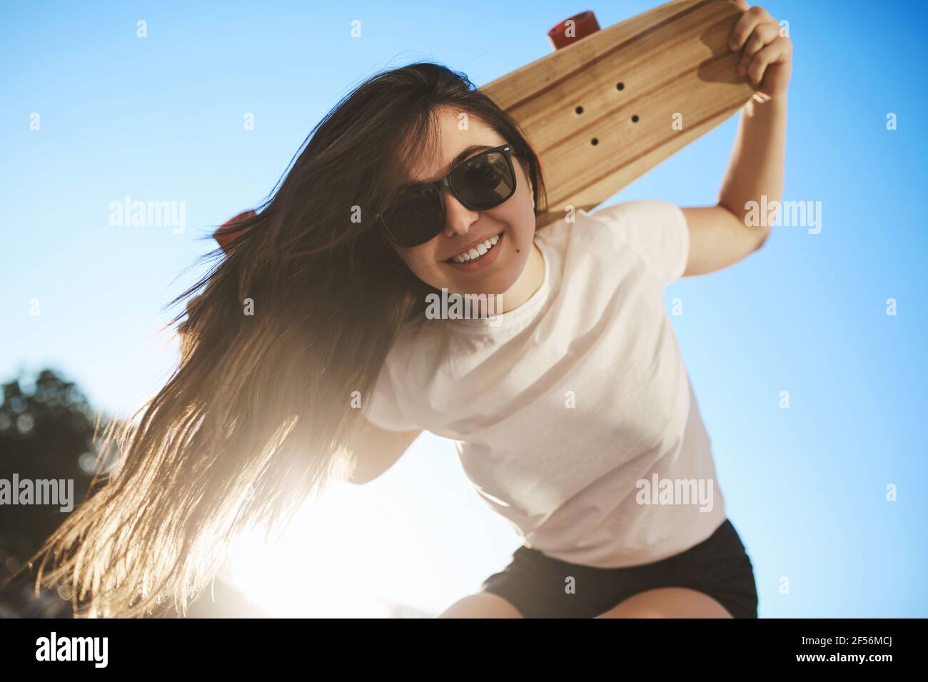 Beautiful girl bending down hi-res stock photography and images - Alamy
