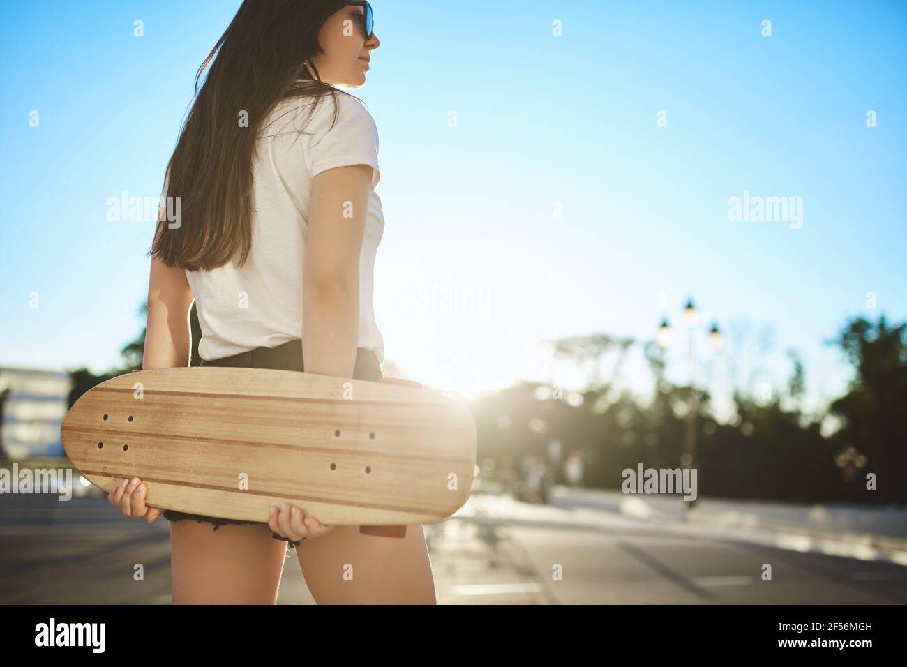 Brunette Girl Riding Penny Board