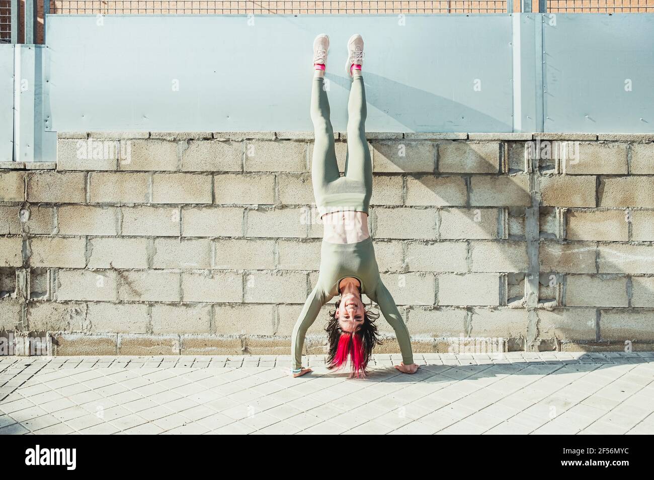 Handstand against wall hi-res stock photography and images - Alamy