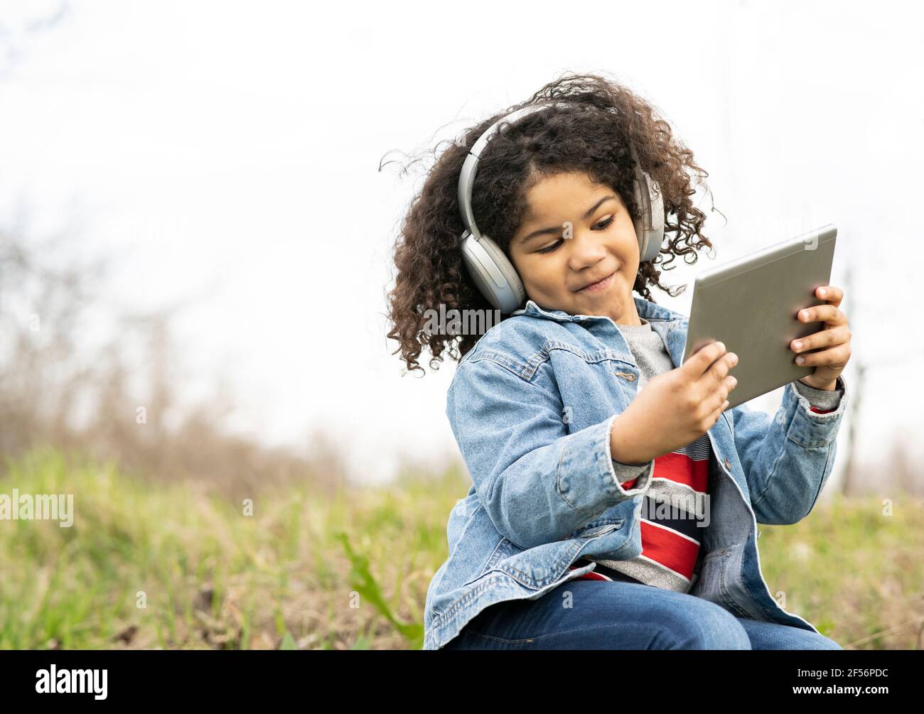 Boy using computer with headphones hi-res stock photography and images ...