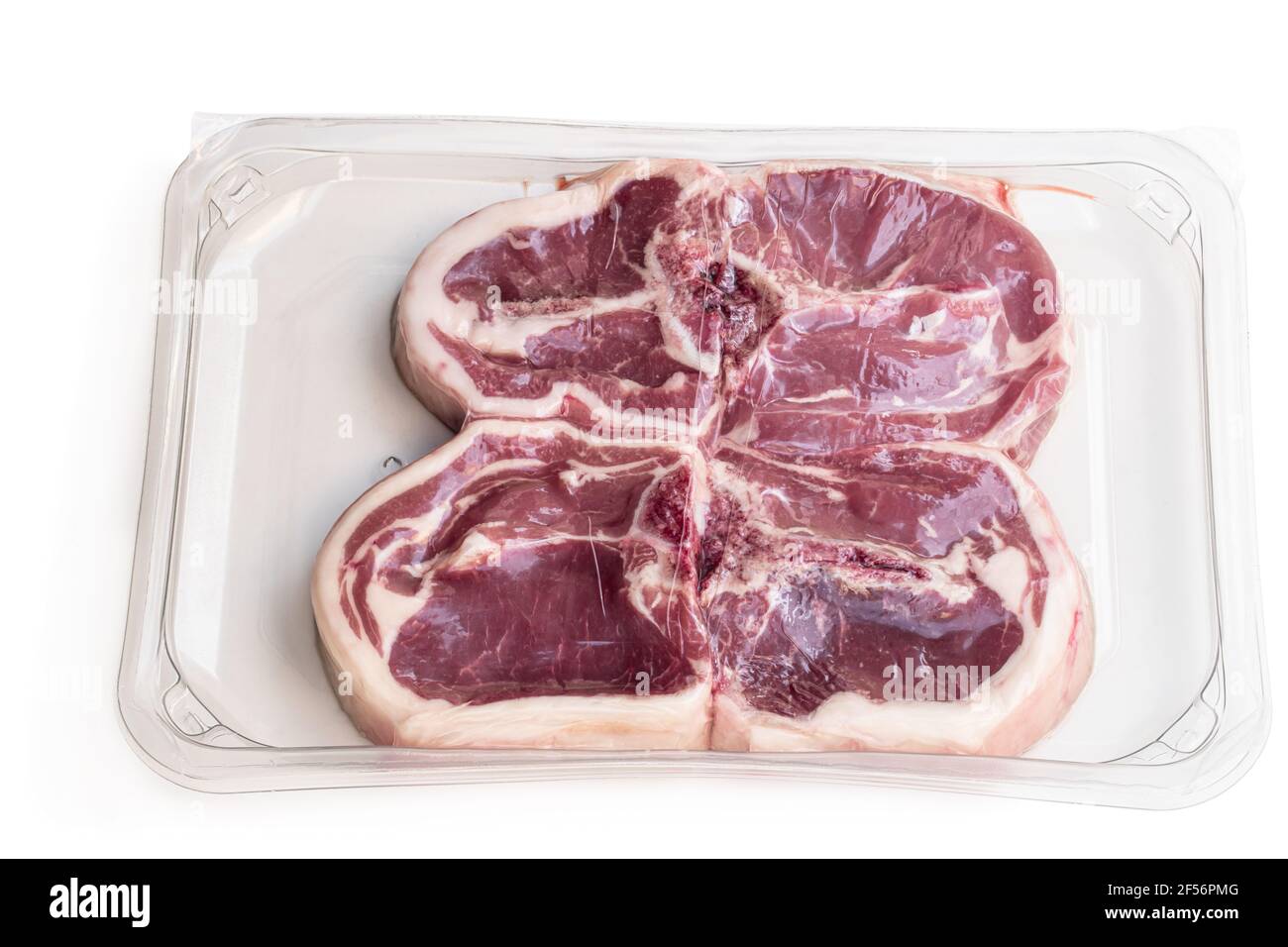 Raw lamb chops in vacuum package isolated on white Stock Photo - Alamy