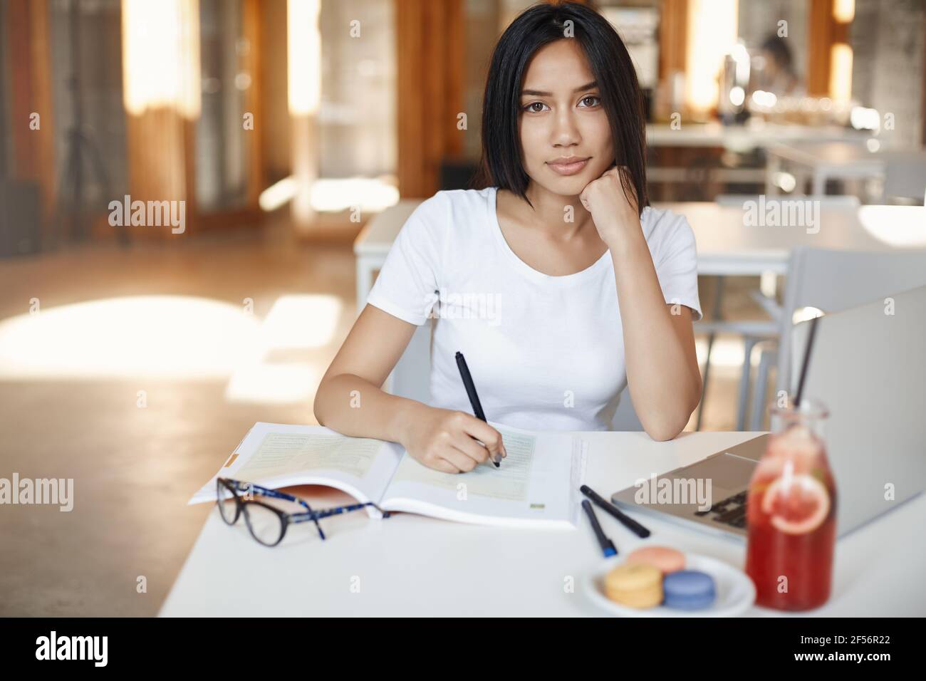 Young lifestyle and digital nomad concept. Attractive female student ...