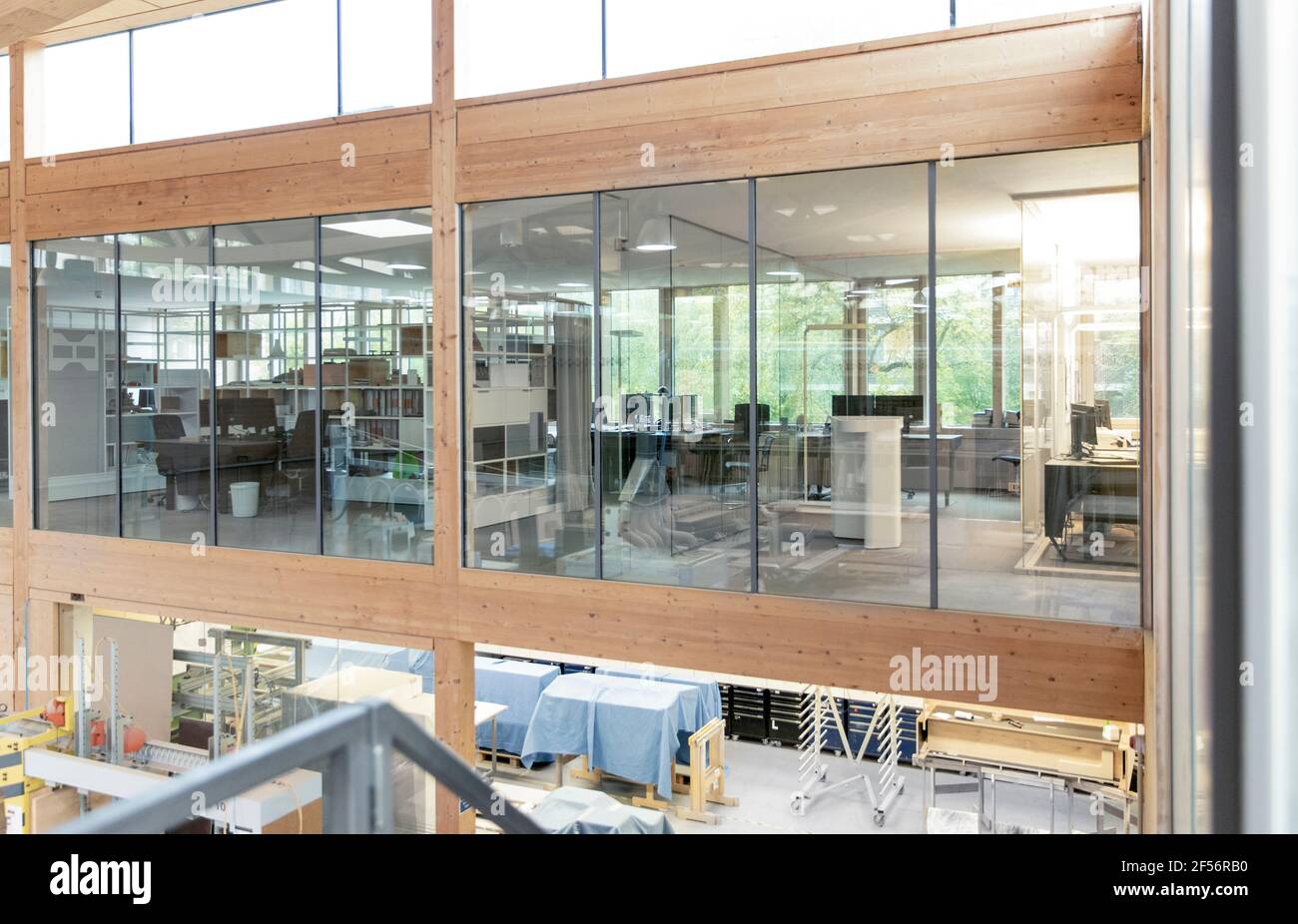 Empty office floor seen through glass walls in factory Stock Photo - Alamy