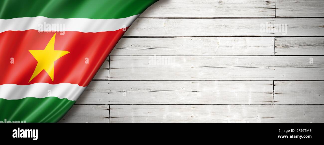 Suriname flag on old white wall. Horizontal panoramic banner Stock ...