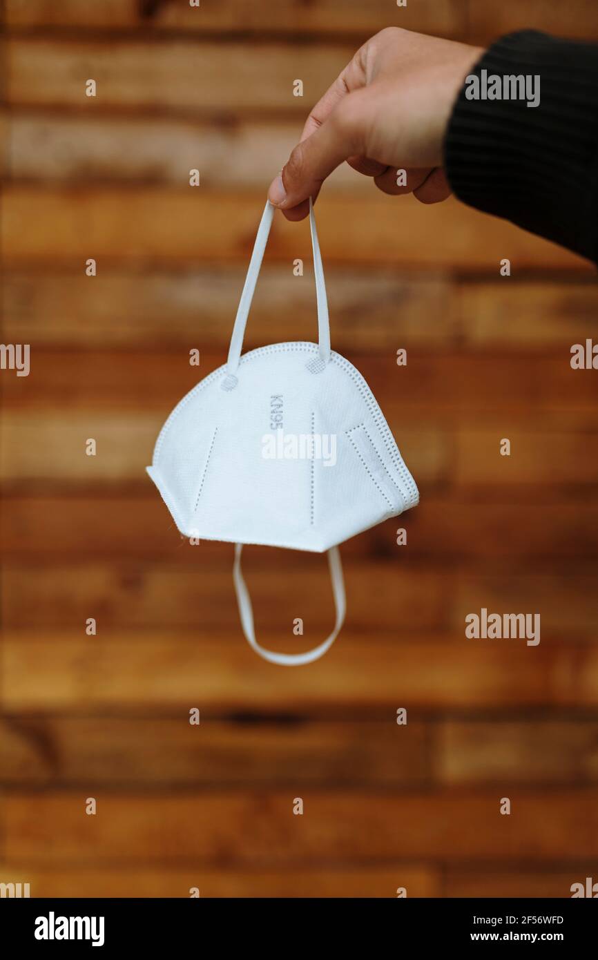 Man holding mask face hi-res stock photography and images - Alamy