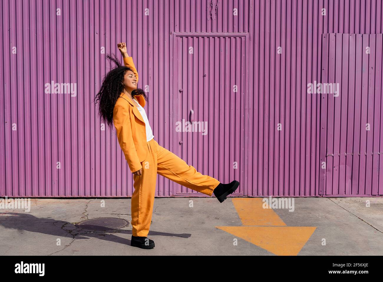 Woman dancing on footpath hi-res stock photography and images - Alamy