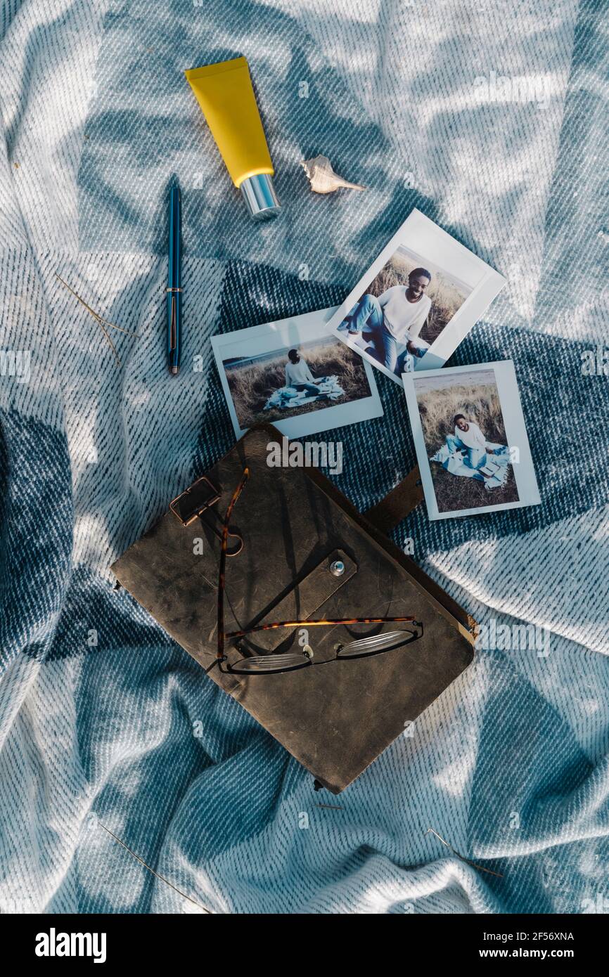 Diary with photographs of man and cream on blanket Stock Photo - Alamy