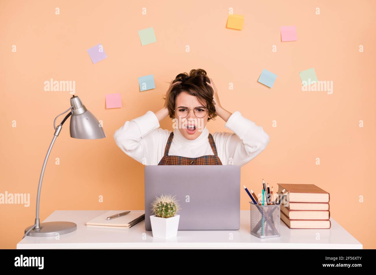 Photo Of Impressed Nice Short Hairdo Girl Sit Look Laptop Hands Head