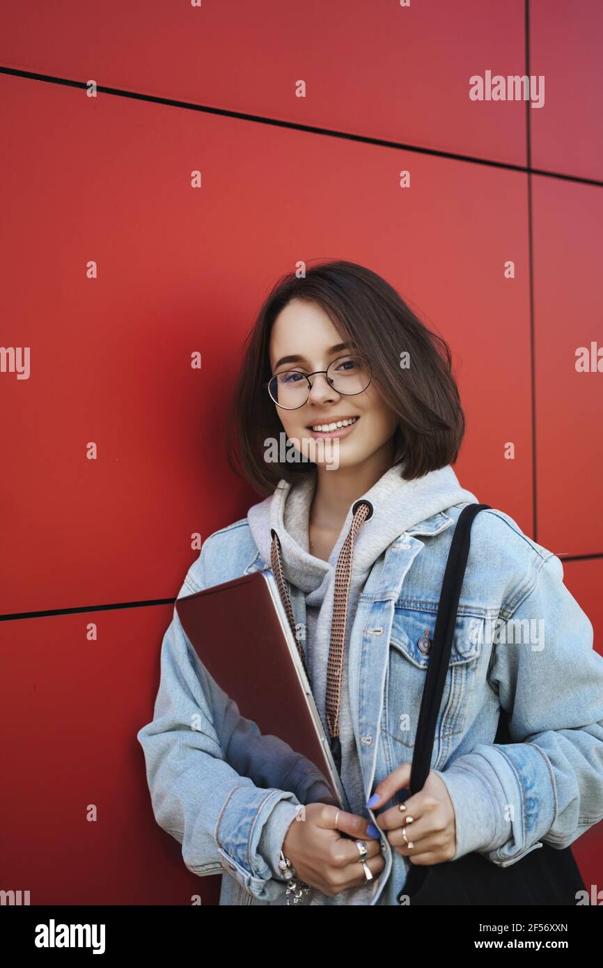 Education, work and youth concept. Vertical portrait of smiling queer ...