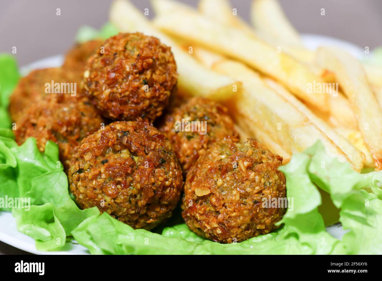 Falafel with French fries, selective focus. Famous street food of East ...