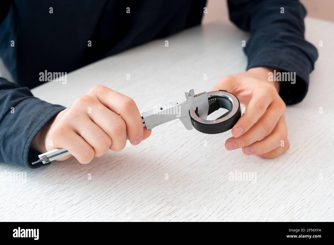 the engineer hand working and measure the parts with caliper tool Stock ...