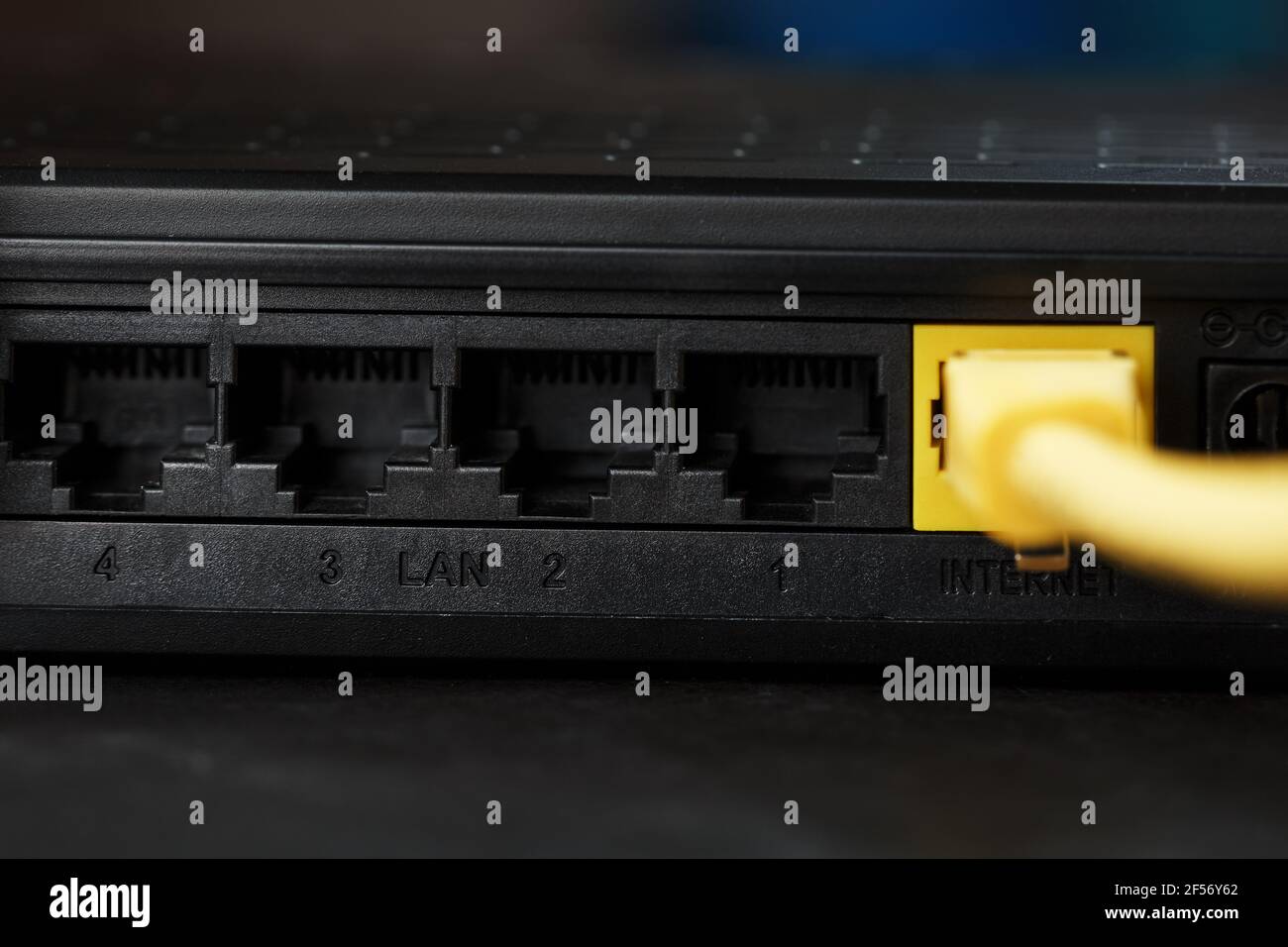 Wireless modem router with yellow cable and LAN port for connection on ...
