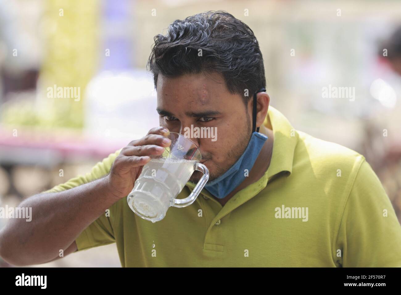 People are drinking various unsafe colorful drinks from roadside ...