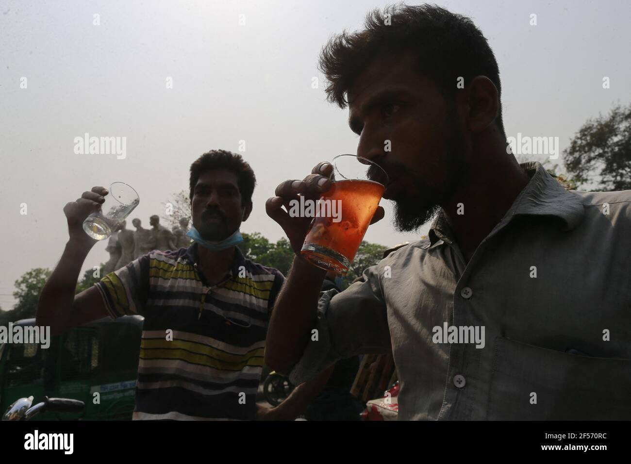 People are drinking various unsafe colorful drinks from roadside ...