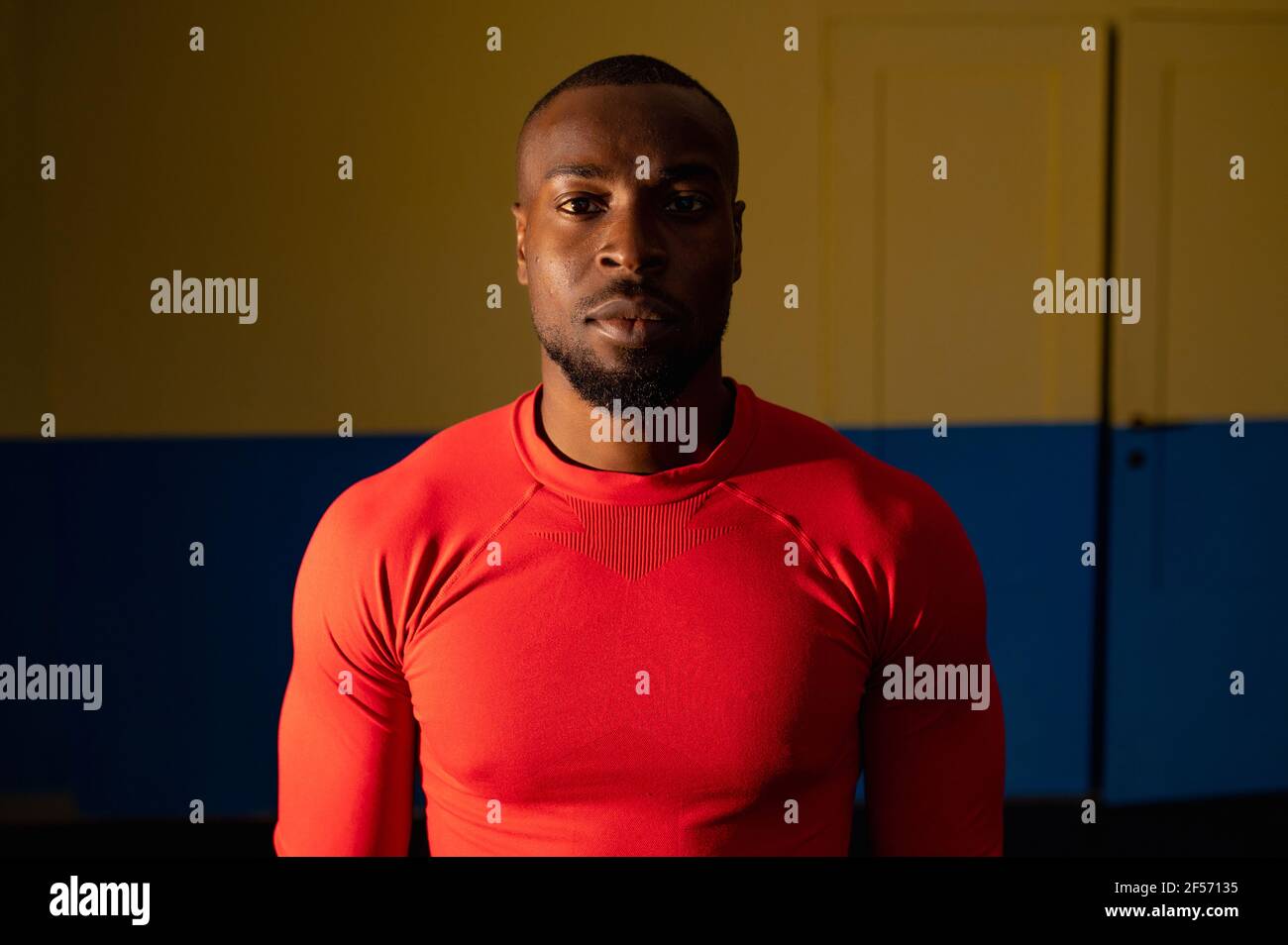 Portrait of African sportive man looking at the camera with serious ...