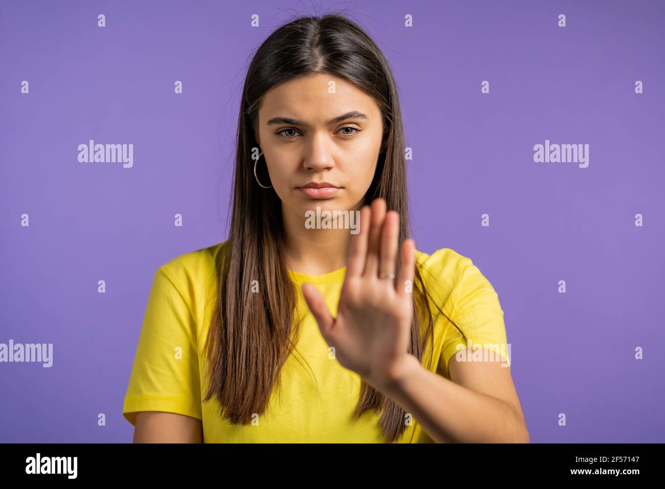 Pretty woman disapproving with NO hand sign gesture. Denying, rejecting ...