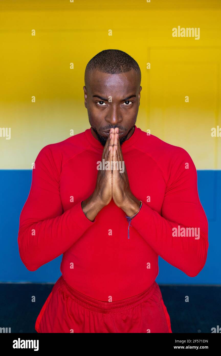 Vertical portrait of black African man concentrated and focused with ...