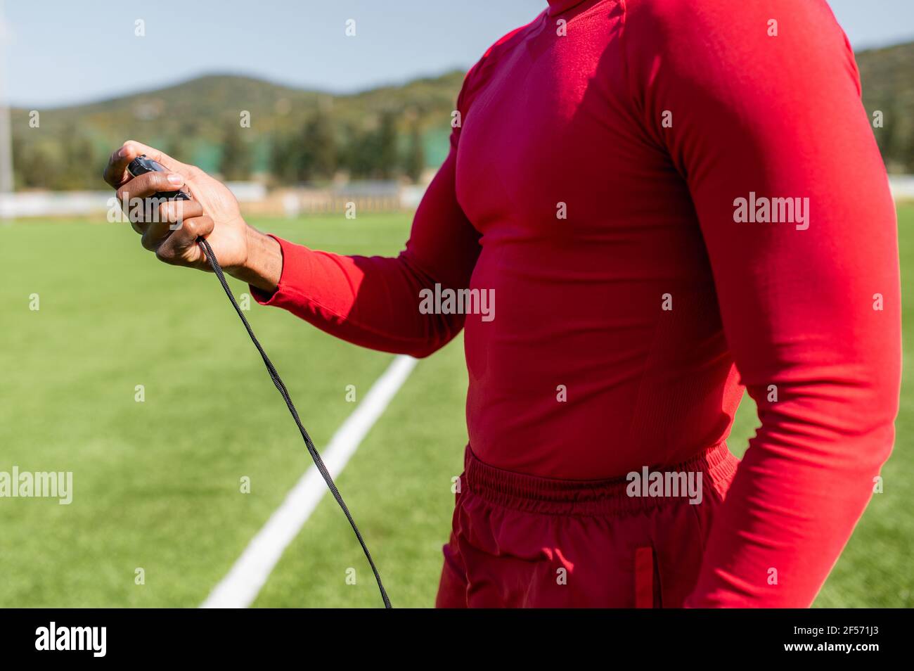 Man holding stopwatch hi-res stock photography and images - Alamy