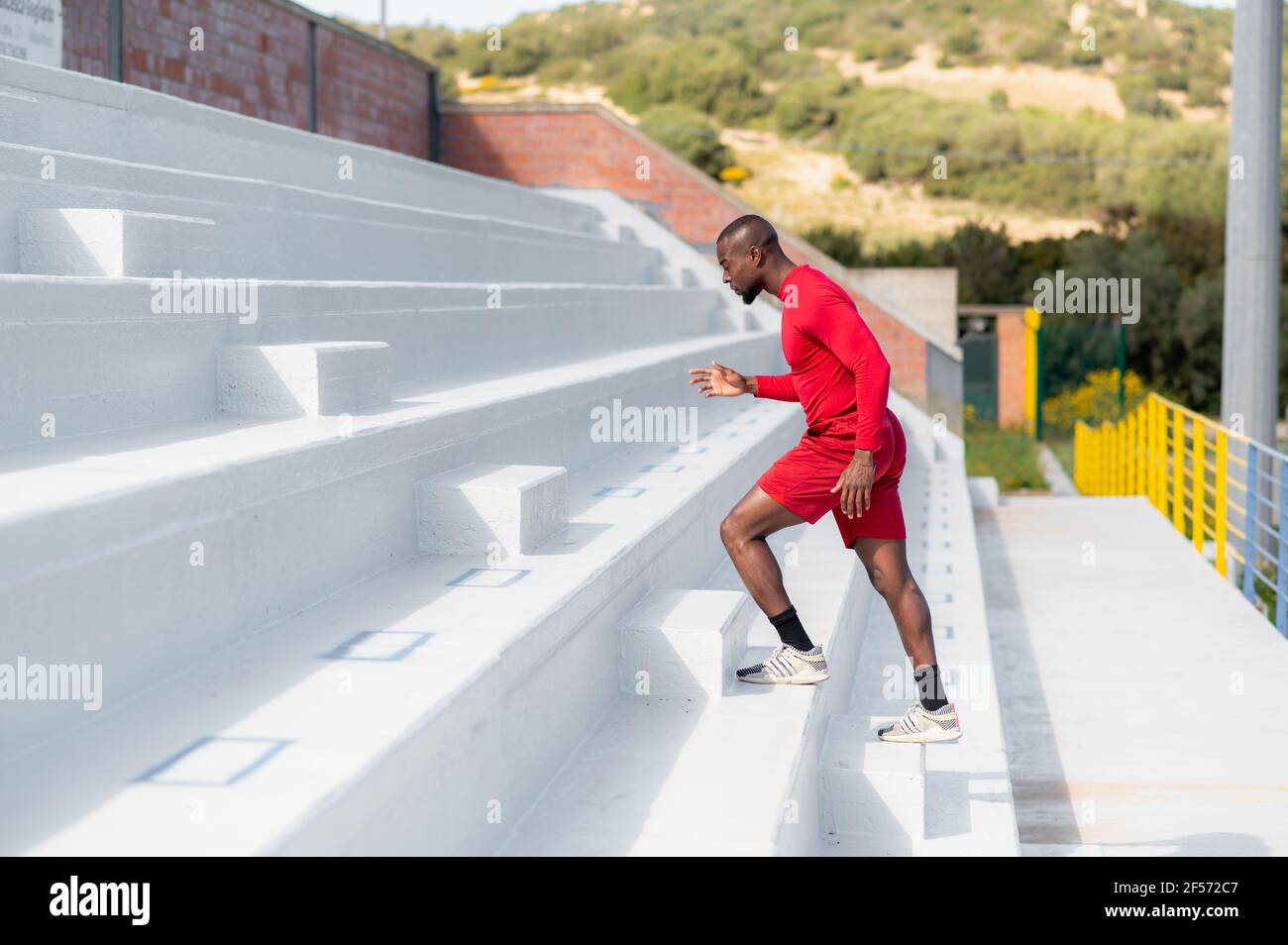 Black man running up stairs hi-res stock photography and images - Alamy