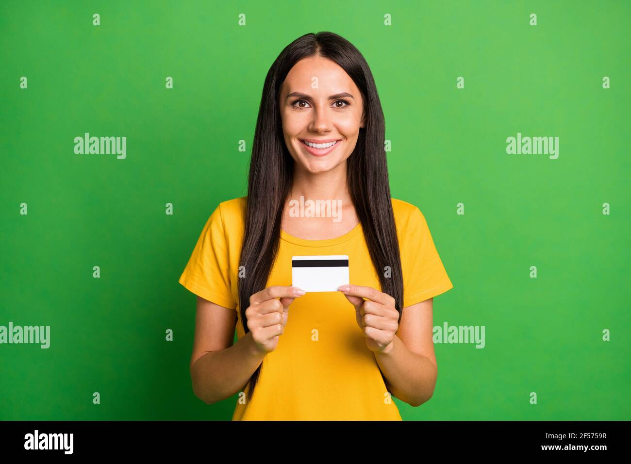 Photo of lovely happy young girl hold debit card salary spend good mood ...