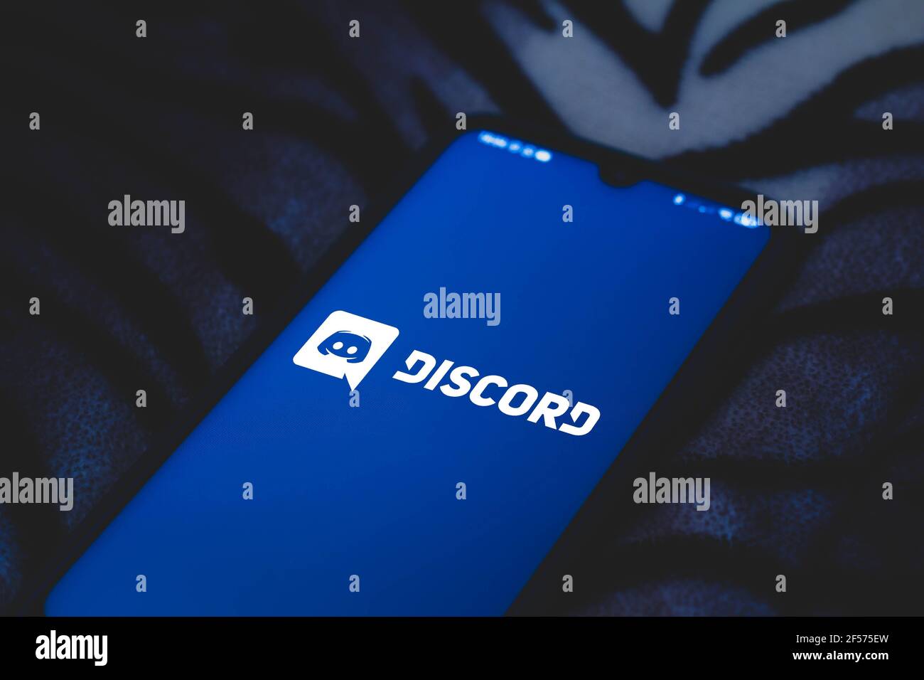 In this photo illustration a Discord logo seen displayed on a ...
