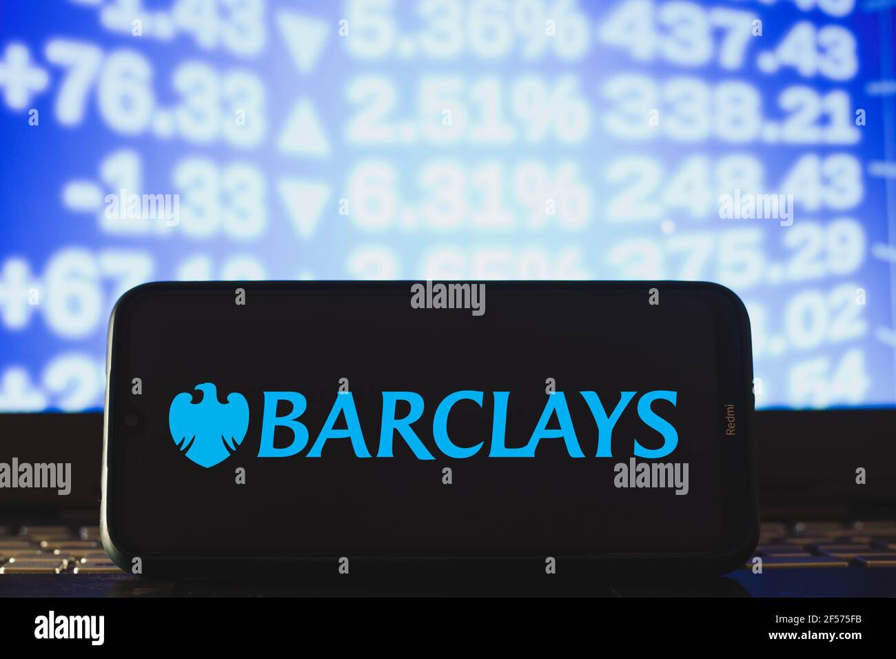 In this photo illustration a Barclays logo seen displayed on a ...