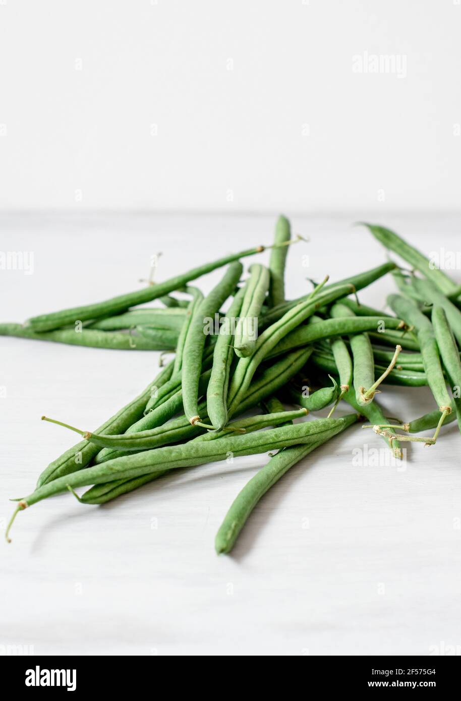 Organic French Beans against a simple plain background Stock Photo - Alamy