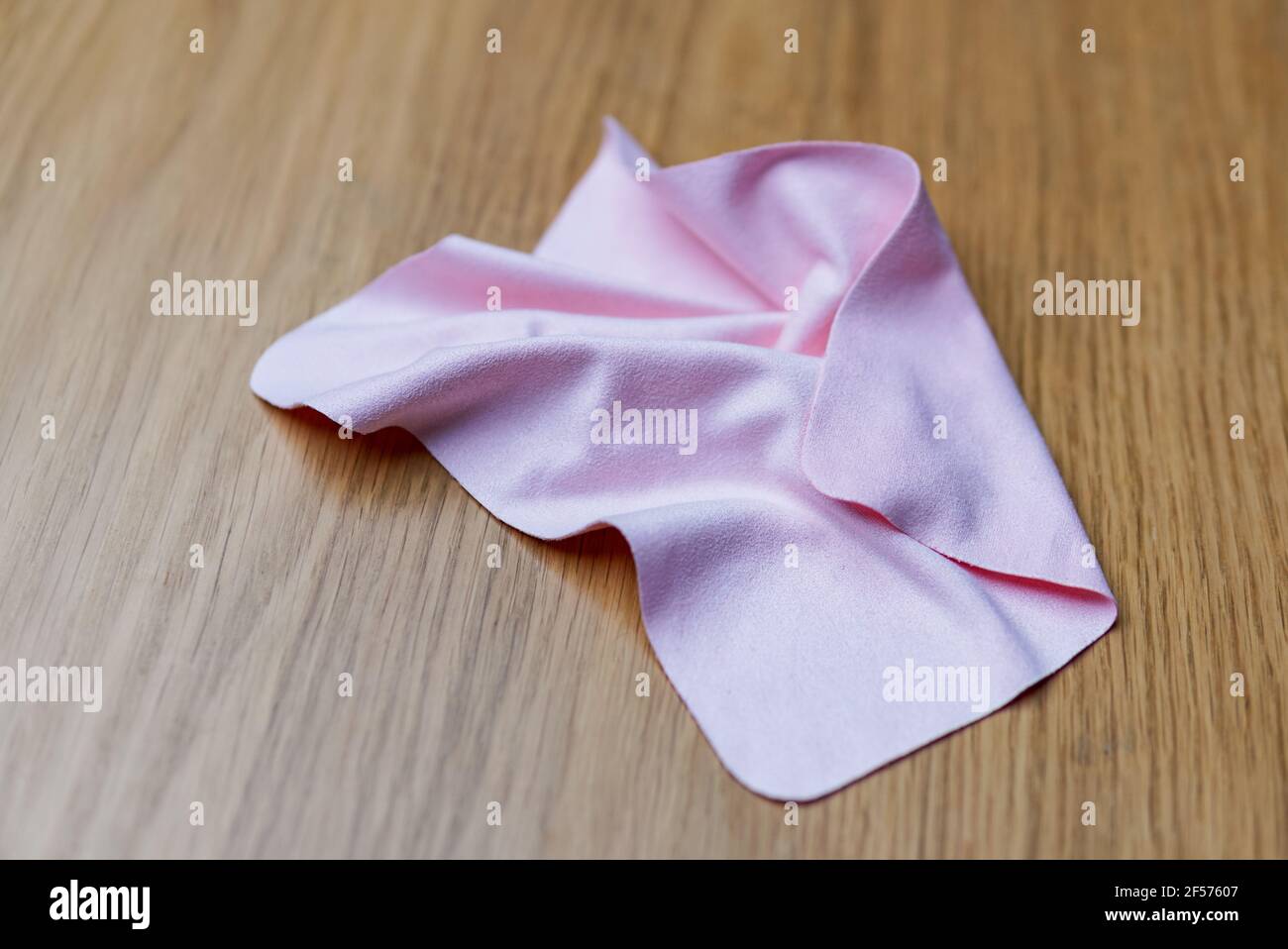 pink soft cloth on a wooden desk Stock Photo - Alamy