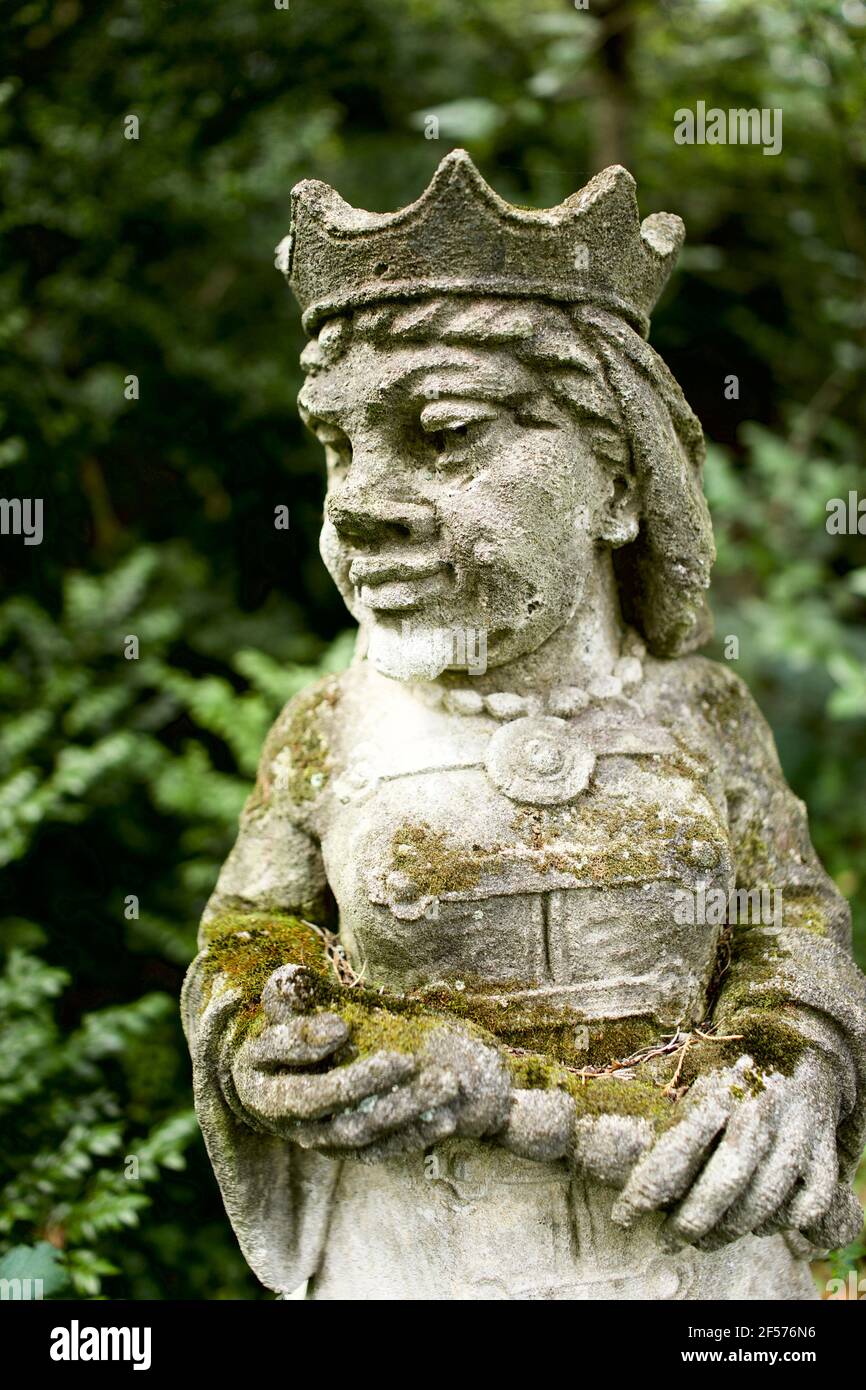 Moss covered statues at Greenwood Gardens in Millburn, NJ, USA. These ...