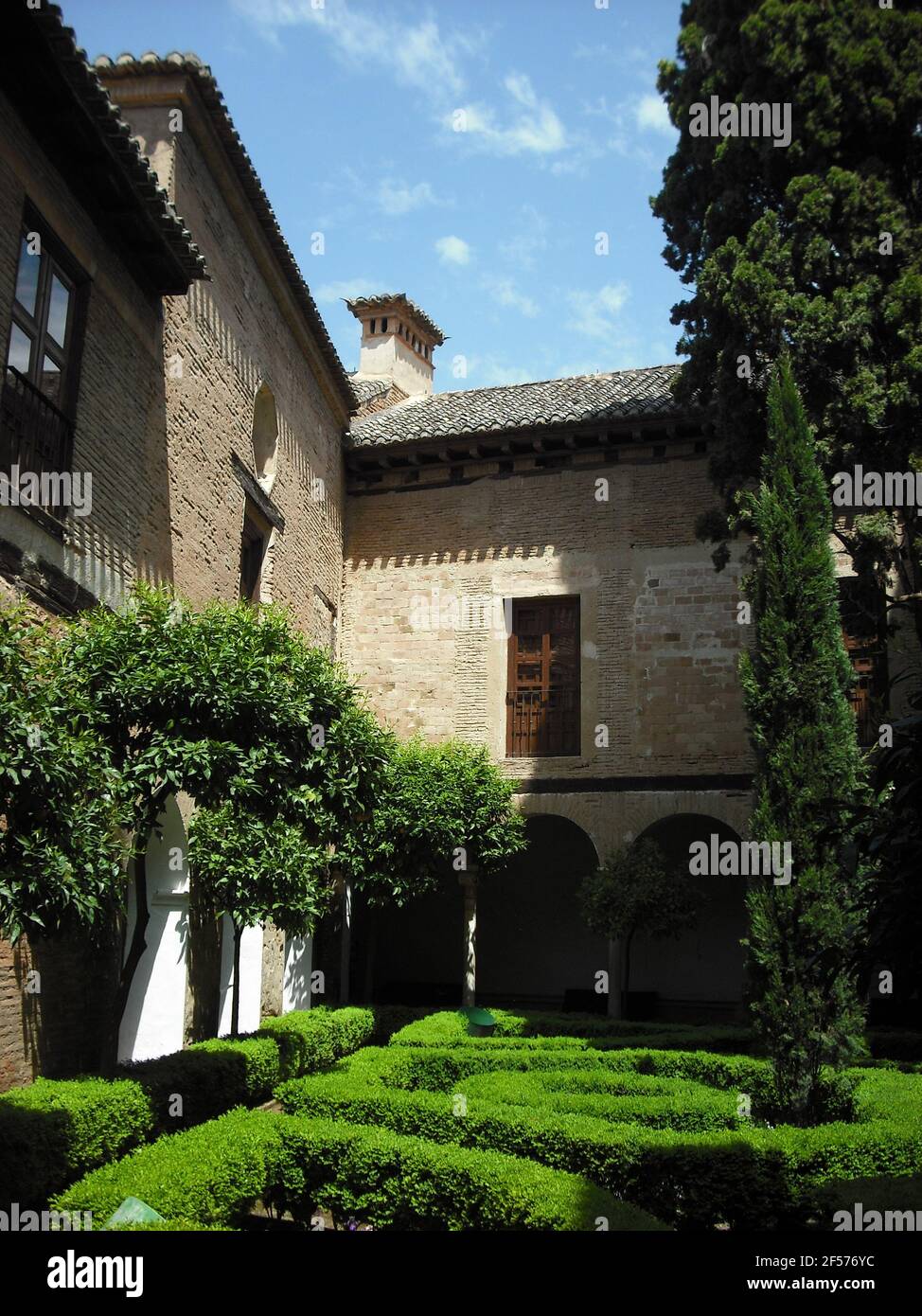 Roman courtyard, a quadrangle, leafy garden with Roman arches. Alhambra ...