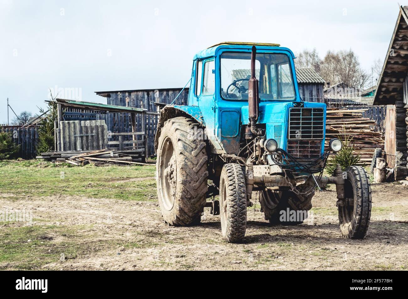 An old tractor front view in the countryside amid barns and sheds Stock ...