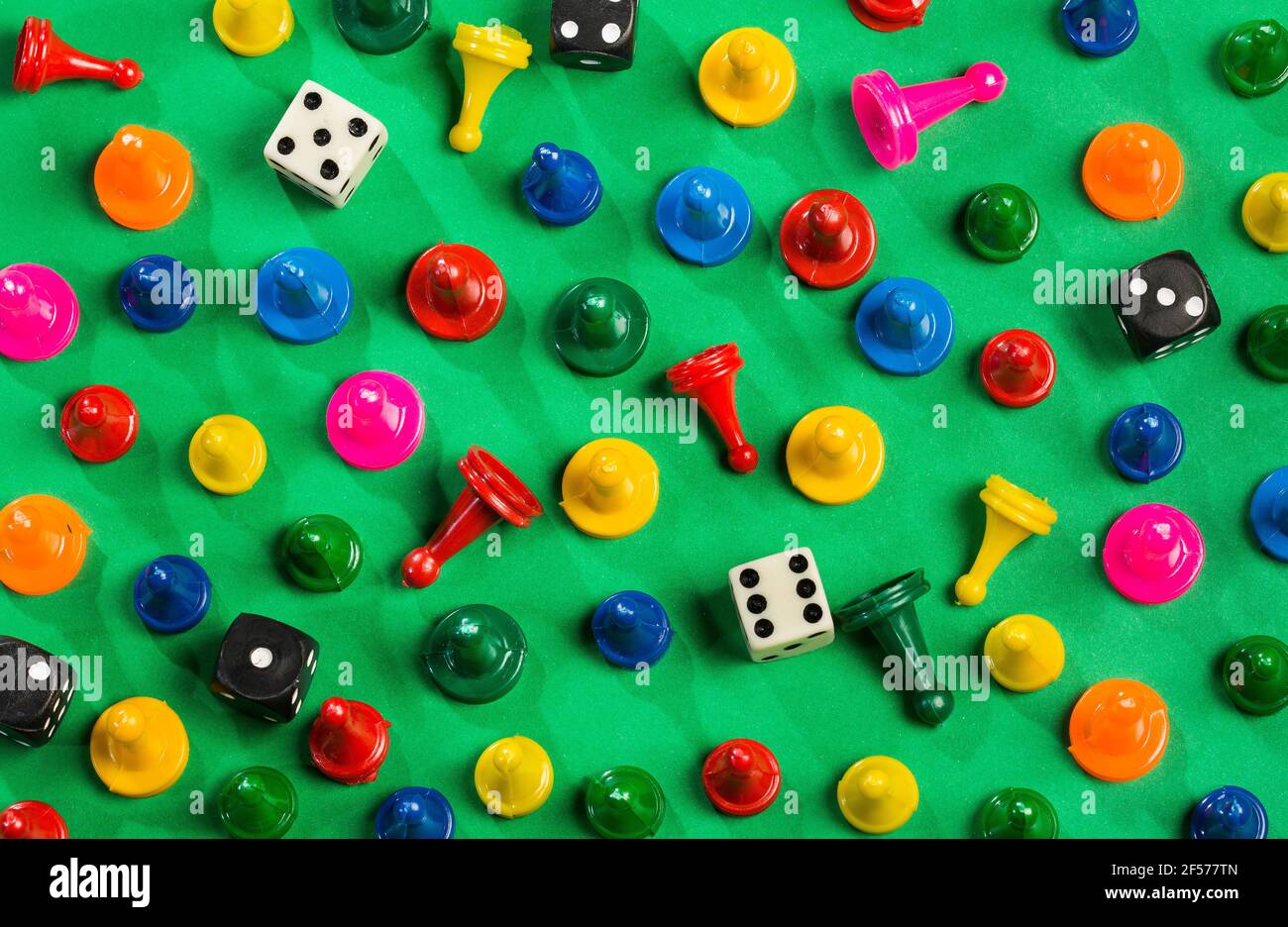 Colorful game pieces and dice Stock Photo - Alamy